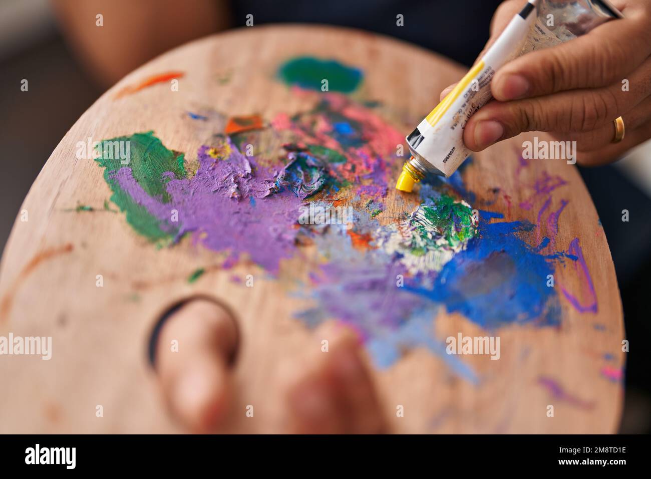 African american man artist mixing color on palette at art studio Stock ...