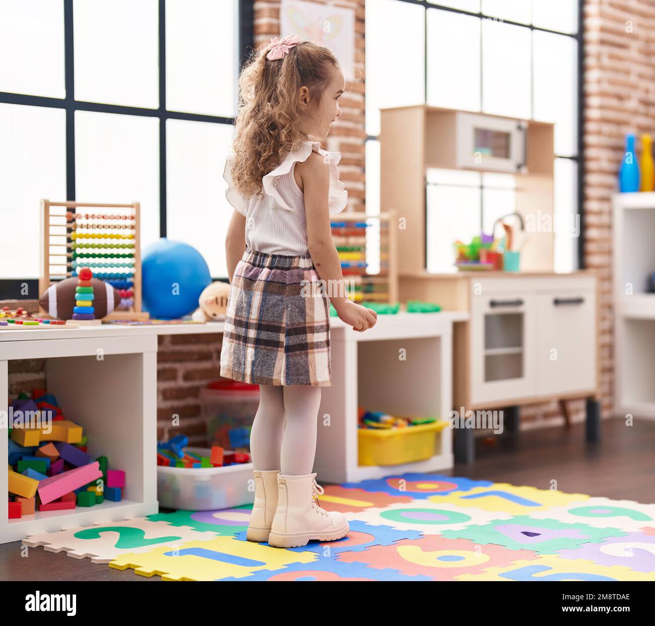 Adorable caucasian girl smiling confident standing at classroom Stock ...