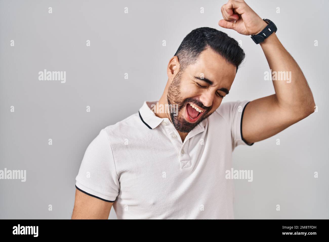 Young hispanic man with beard wearing casual clothes over white ...