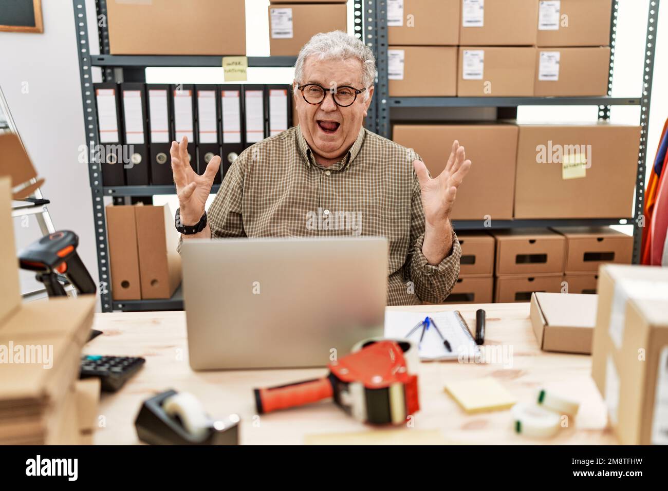 Senior caucasian man working at small business ecommerce with laptop ...