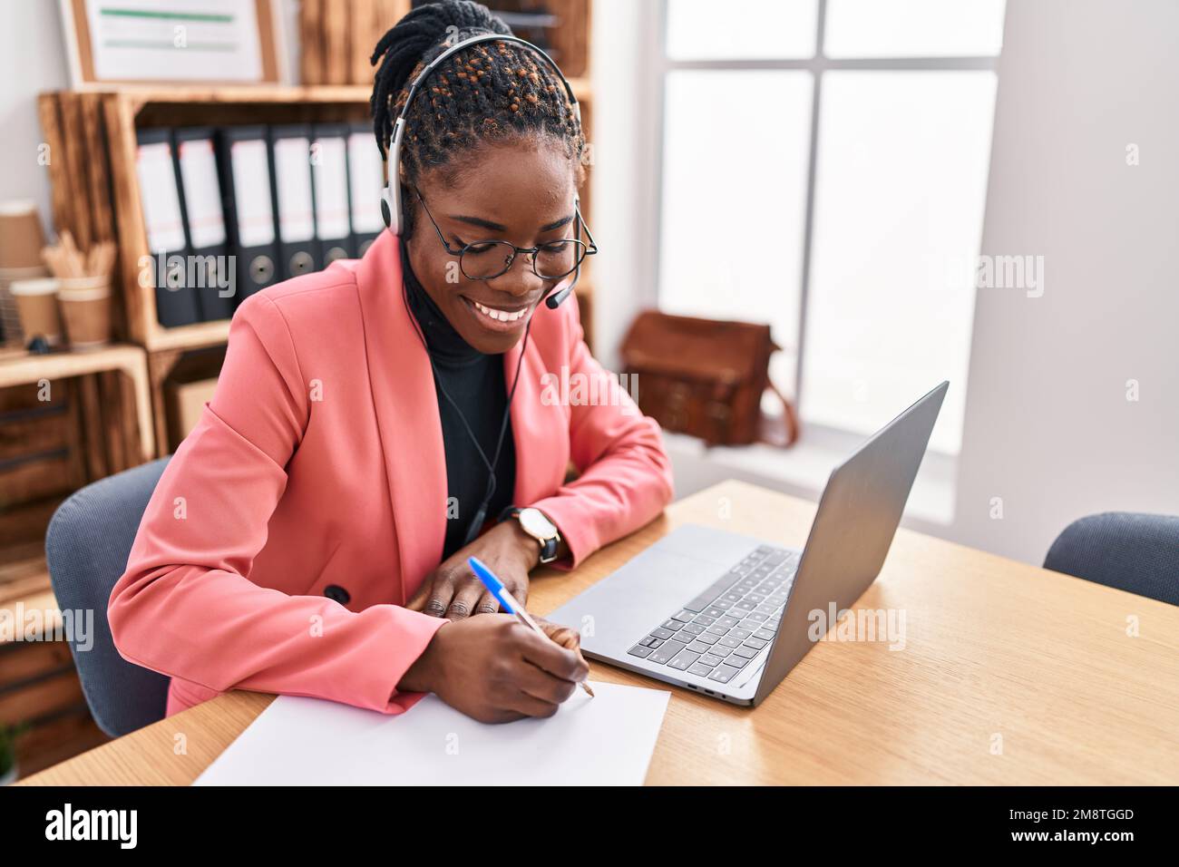 African american woman call center agent working at office Stock Photo ...