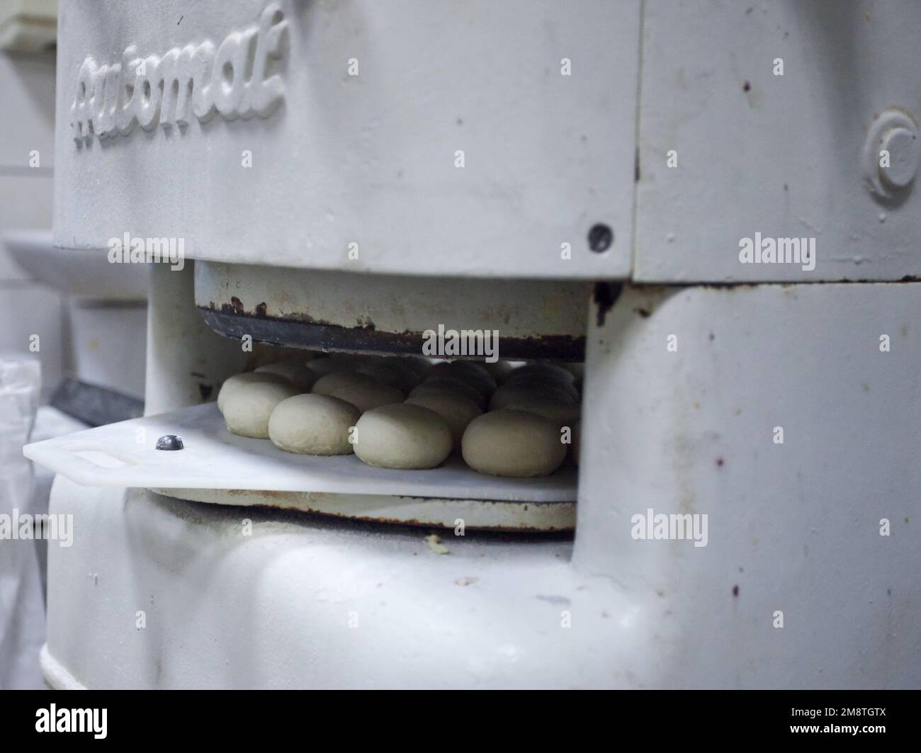 Baking donuts in a pastry shop. Traditional Polish Fat Thursday. donut ...