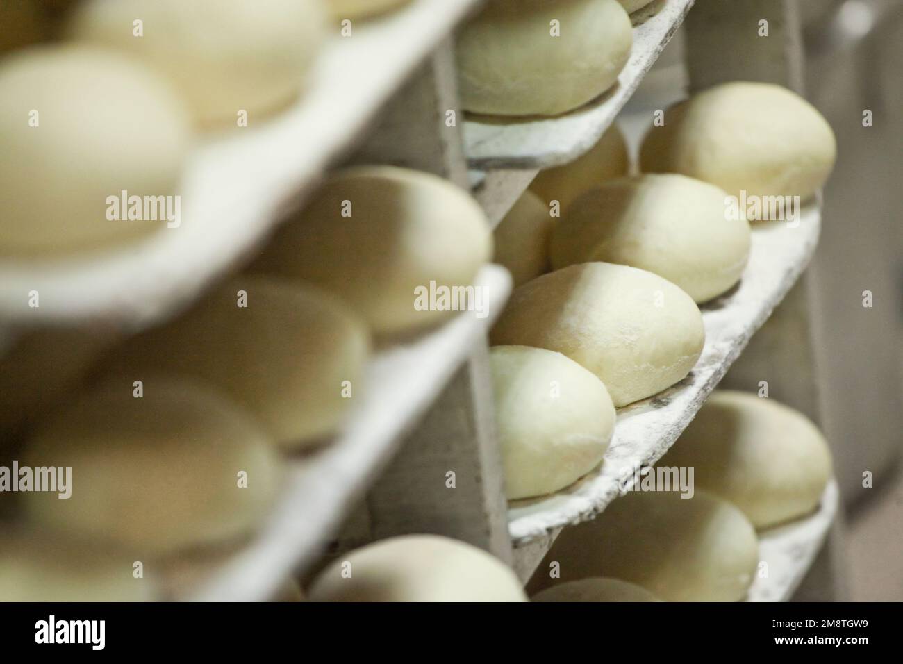 Baking donuts in a pastry shop. Traditional Polish Fat Thursday. donut ...