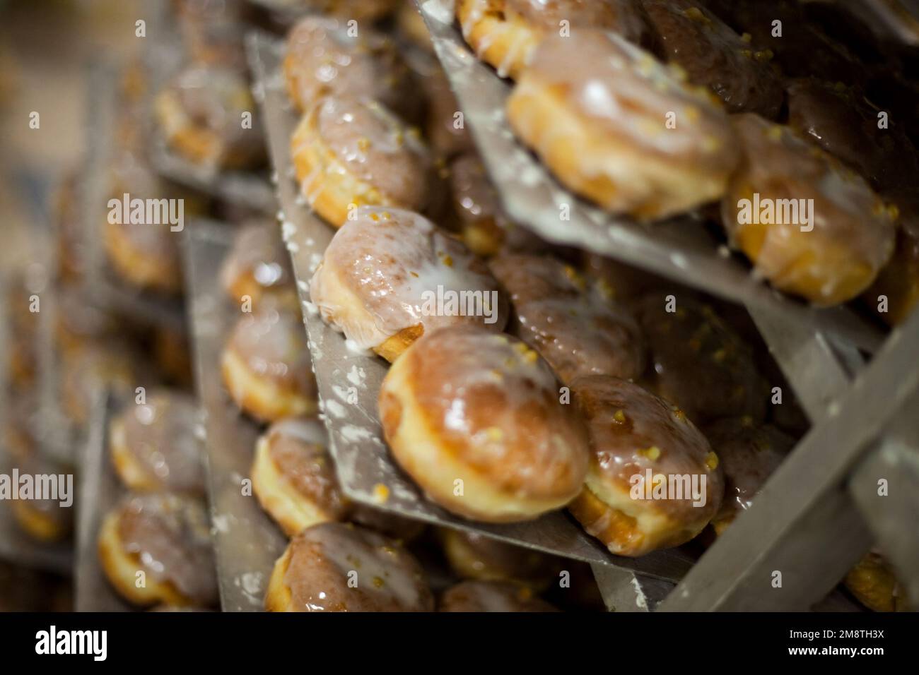 Baking donuts in a pastry shop. Traditional Polish Fat Thursday. donut ...