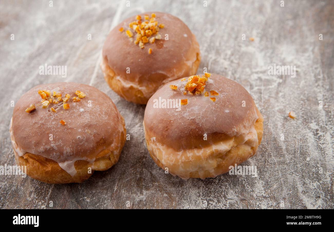 Donuts for Fat Thursday. Polish tradition - fresh donuts with icing and ...