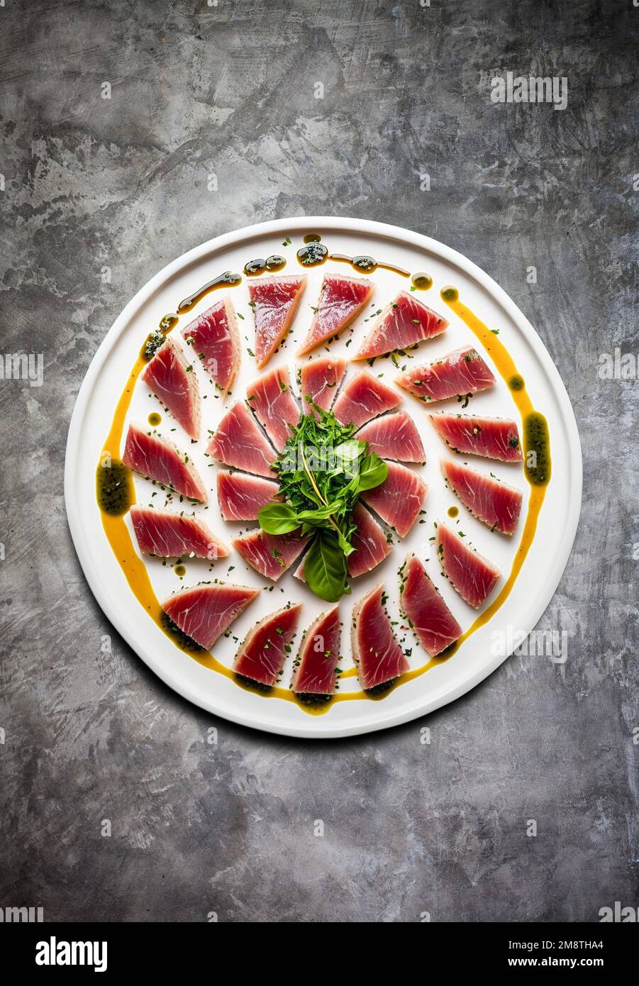 A plate of Marinated Tuna steak sliced Stock Photo - Alamy