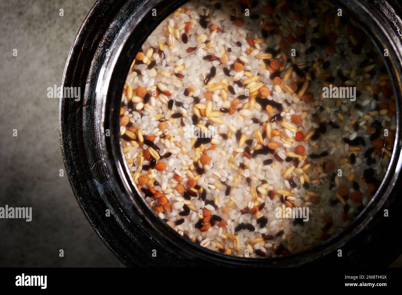 Various grains in a stone pot Stock Photo - Alamy