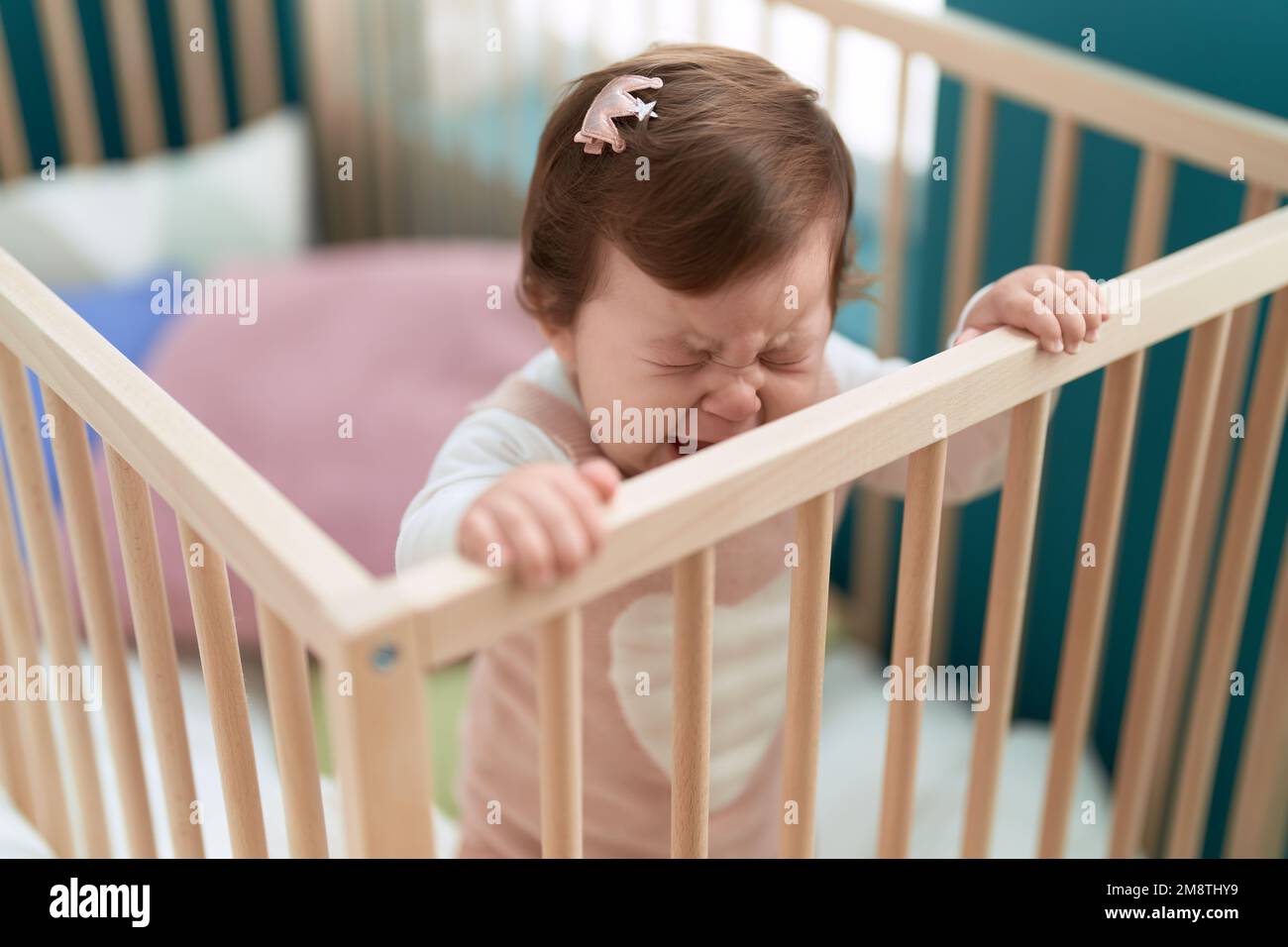 Child standing leaning on bed hi-res stock photography and images - Alamy
