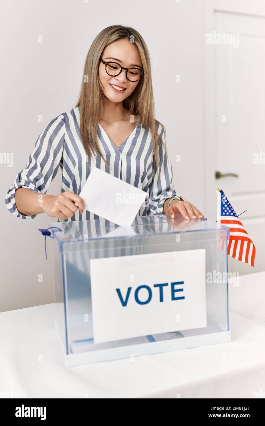Young chinese woman smiling confident voting at electoral college Stock ...