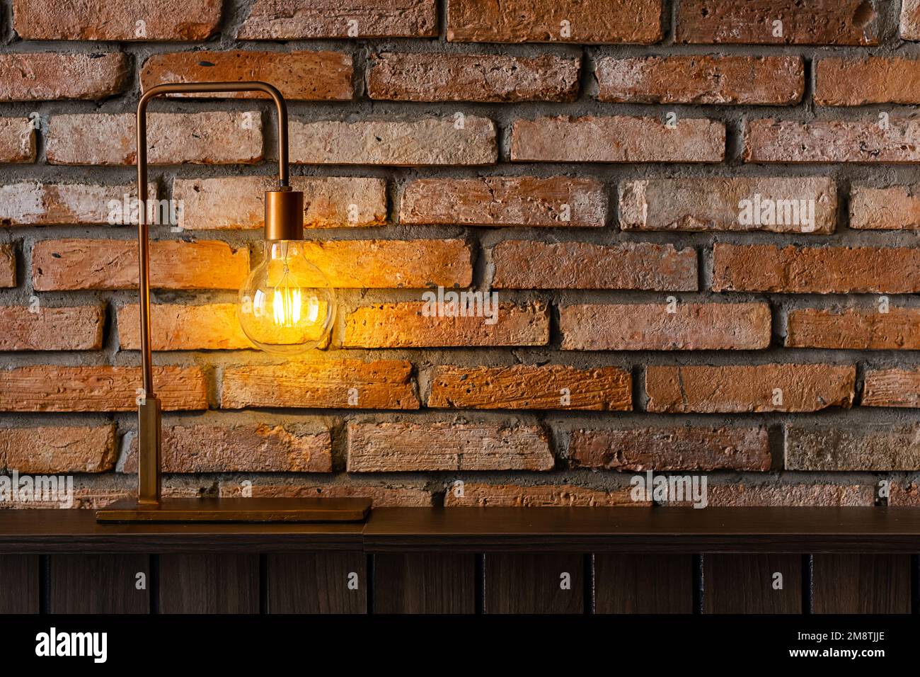 Bulb lamp against brick wall. Loft style design background Stock Photo ...