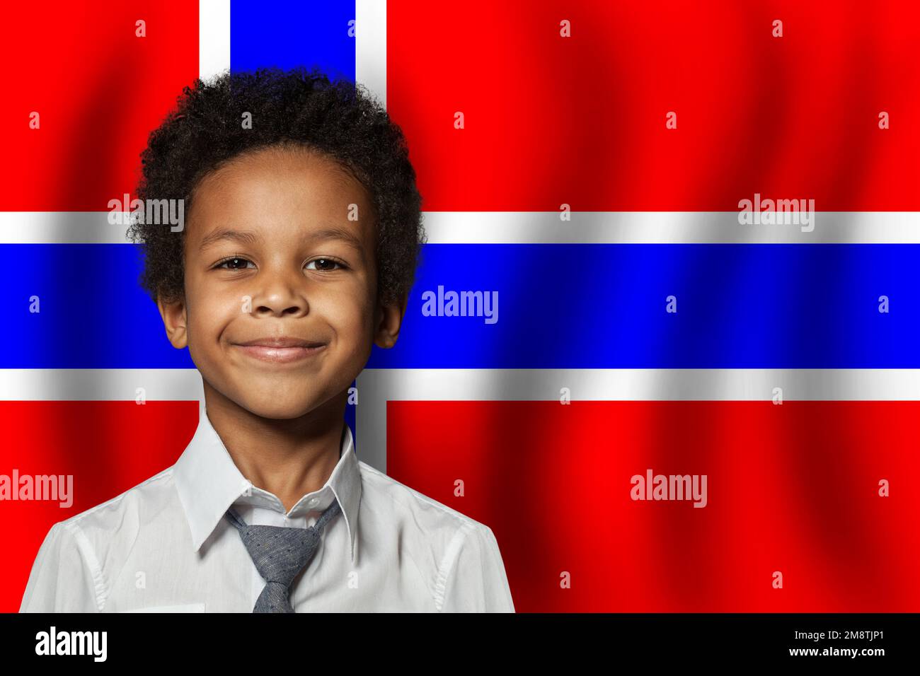 Norwegian kid boy on flag of Norway background. Education and childhood ...