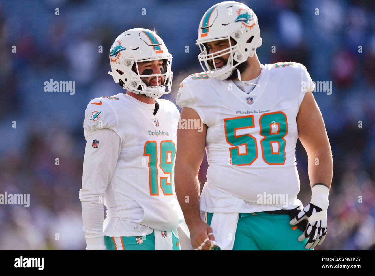 Miami Dolphins quarterback Skylar Thompson (19) talks with guard Connor ...
