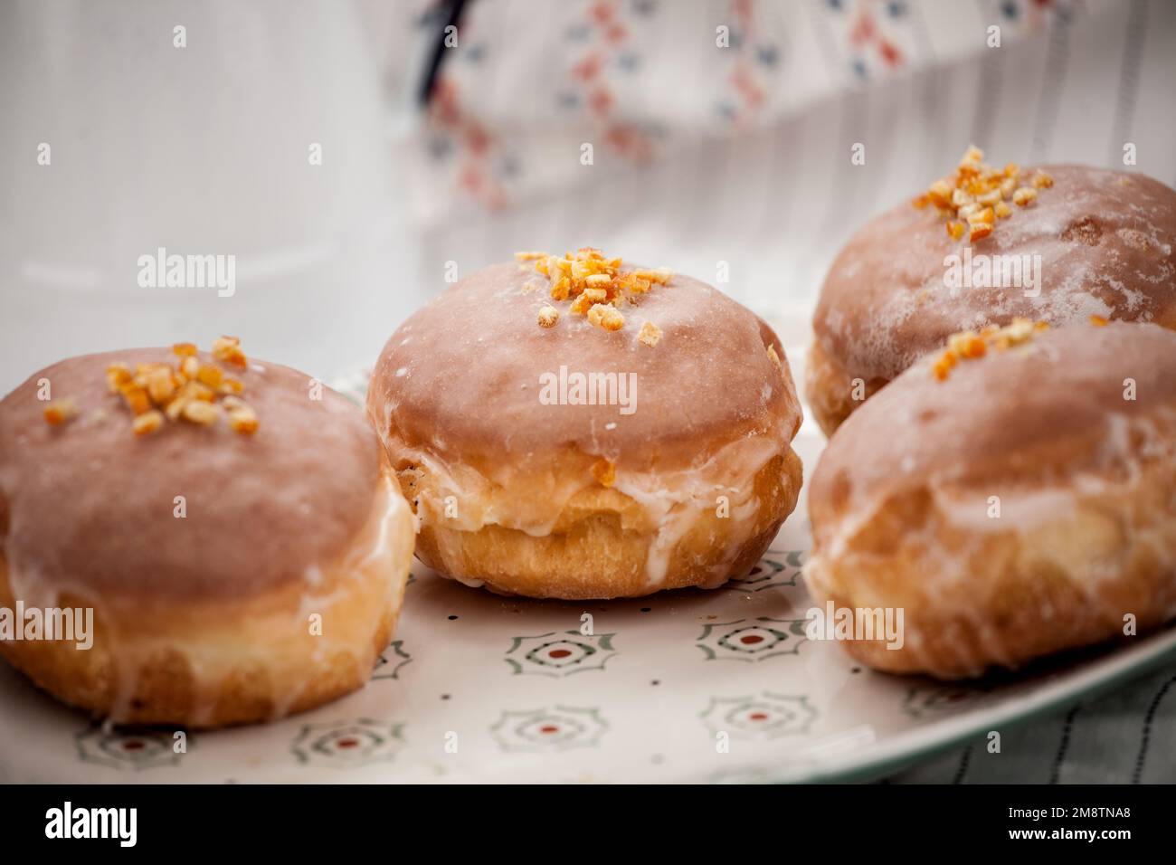 Donuts for Fat Thursday. Polish tradition - fresh donuts with icing and ...