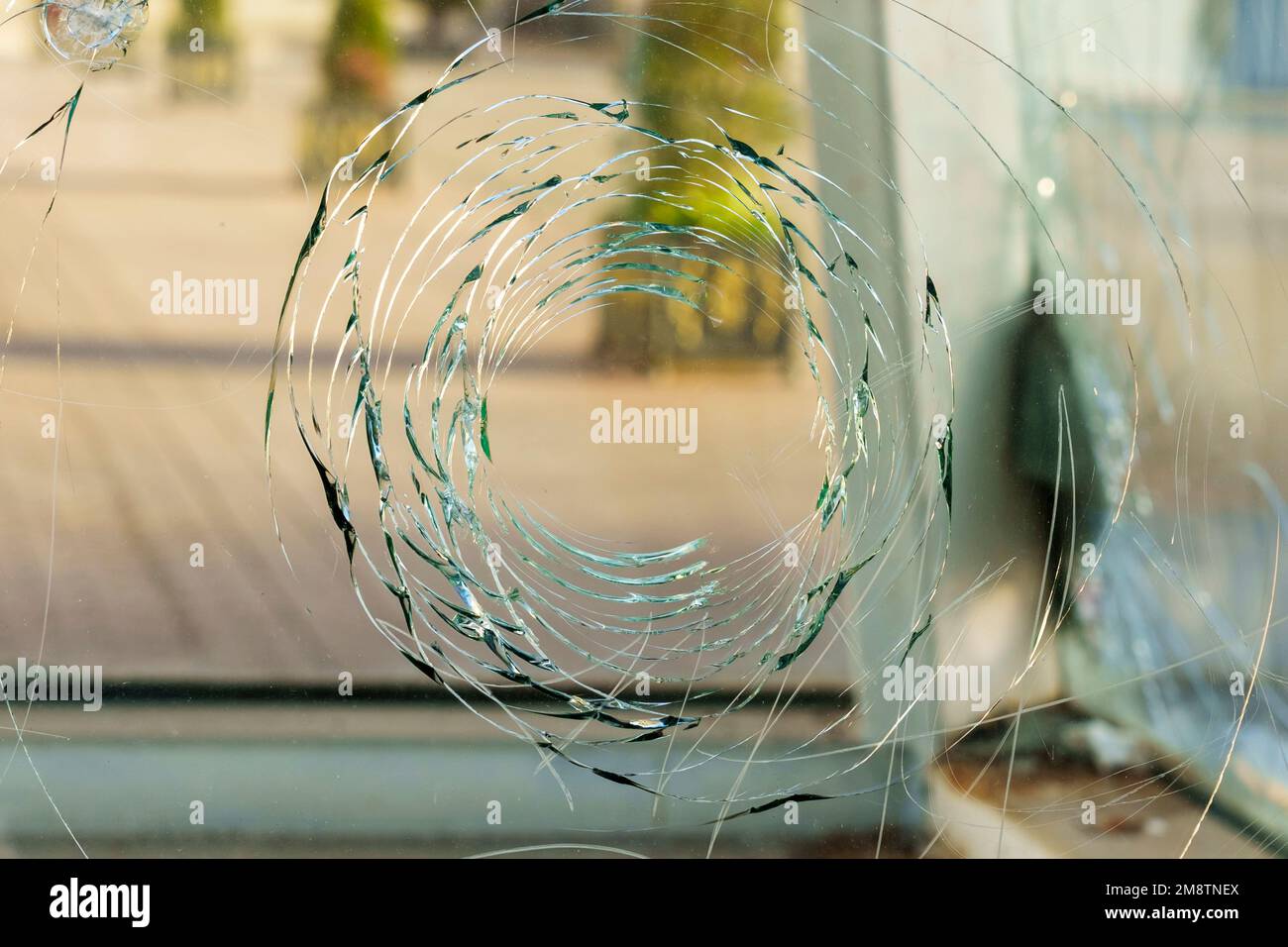 Broken glass construction with a round hole in the street Stock Photo ...