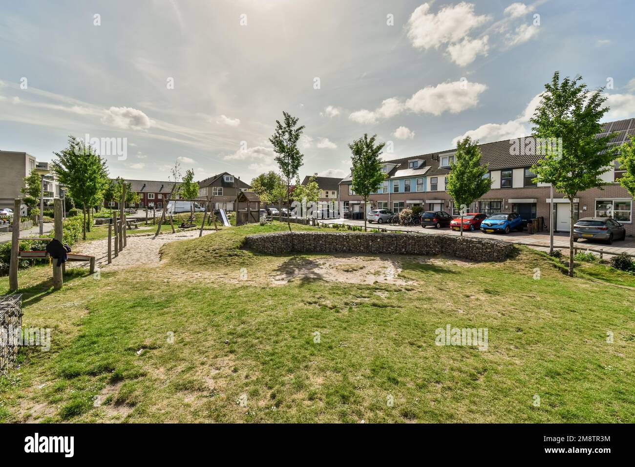 an empty lot in the middle of a residential area, with lots of houses ...
