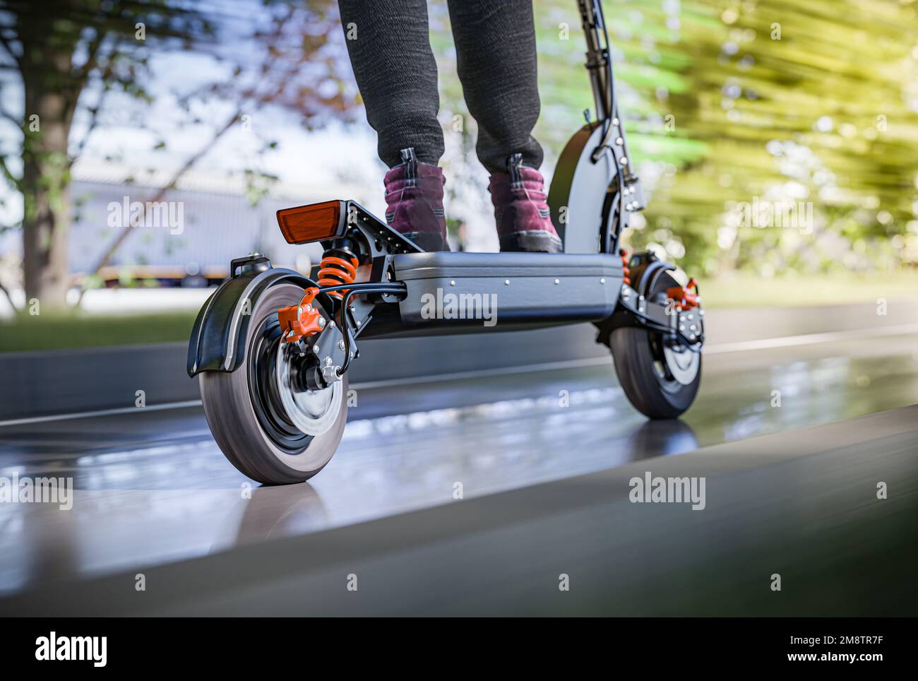 Electric scooter fast ride through the city - closeup to back wheel ...
