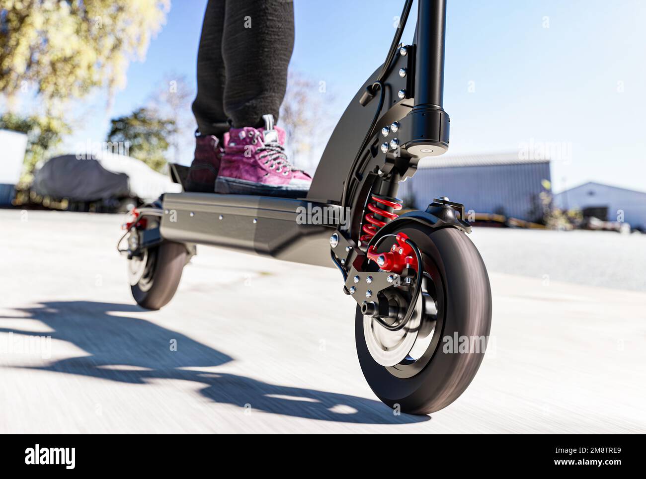 Electric scooter fast ride through the city - closeup to back wheel ...