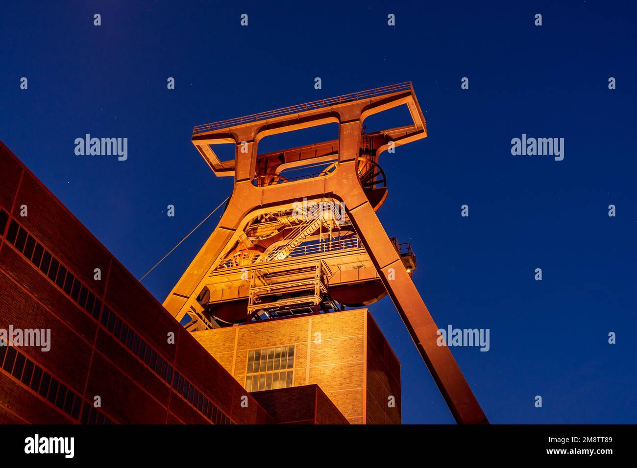 German mining industry by night. The winding tower transports the ...