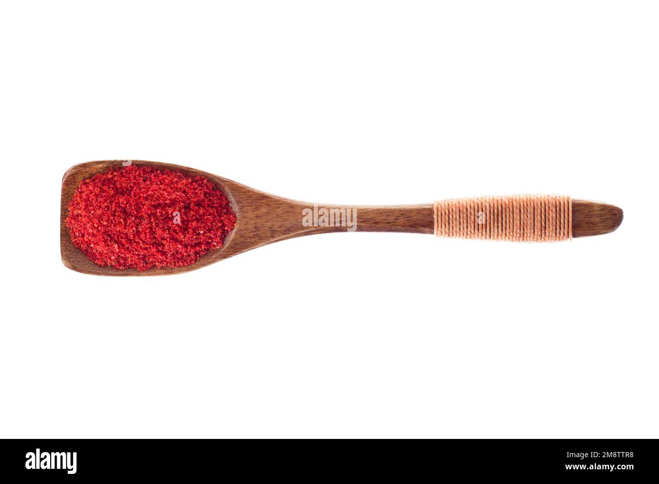chili pepper powder in a spoon, top view. condiment isolated on white ...