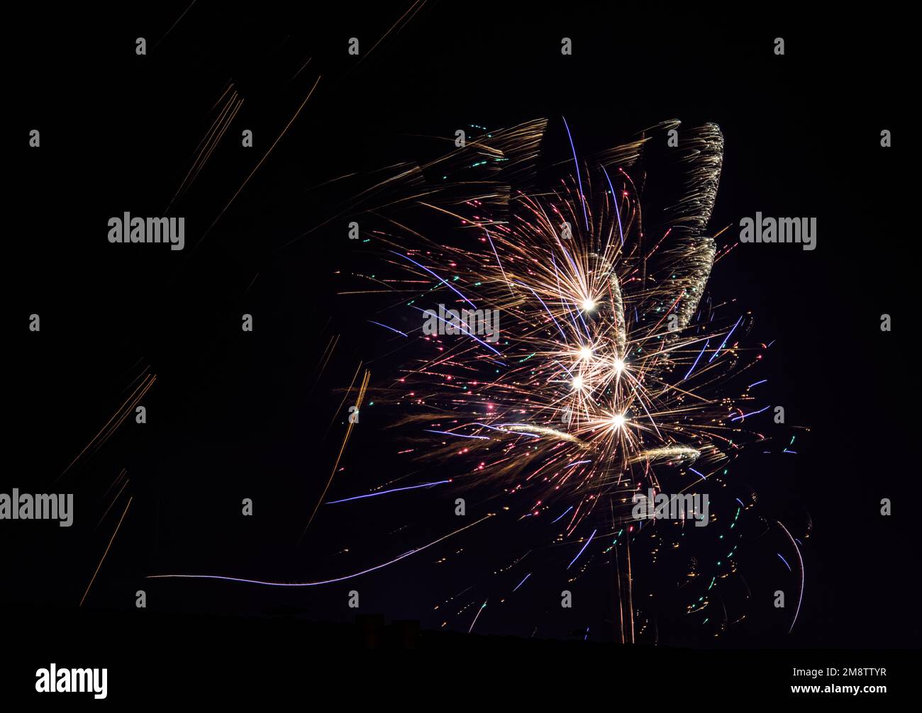 Fireworks exploding in the night sky Stock Photo - Alamy