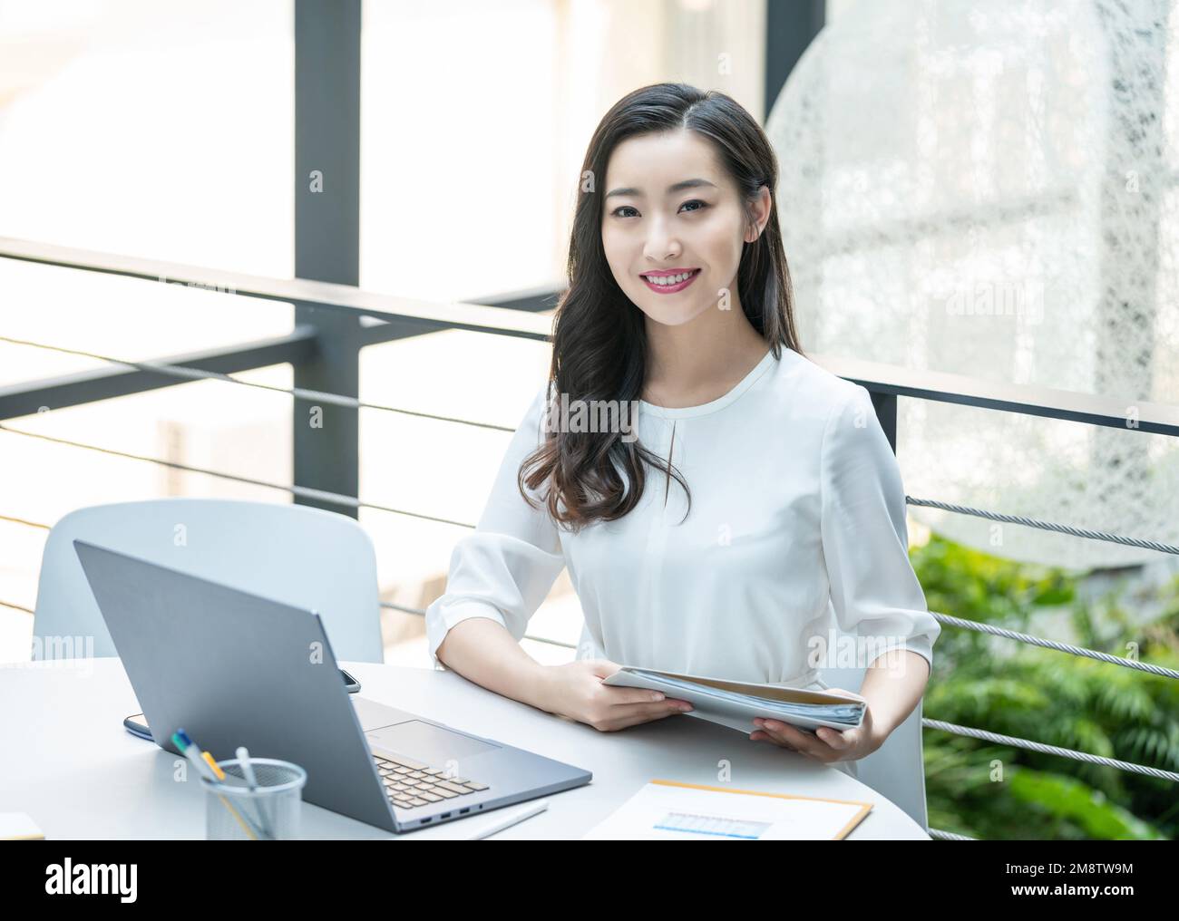 Young business lady at work Stock Photo - Alamy