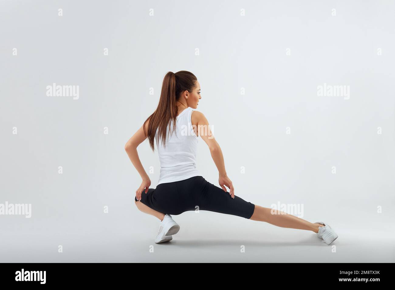 Fitness woman doing stretching exercise Stock Photo - Alamy