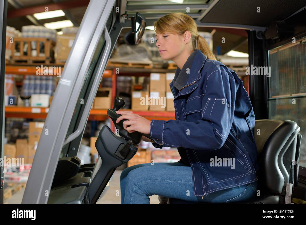 portrait of a woman forklift operator Stock Photo - Alamy