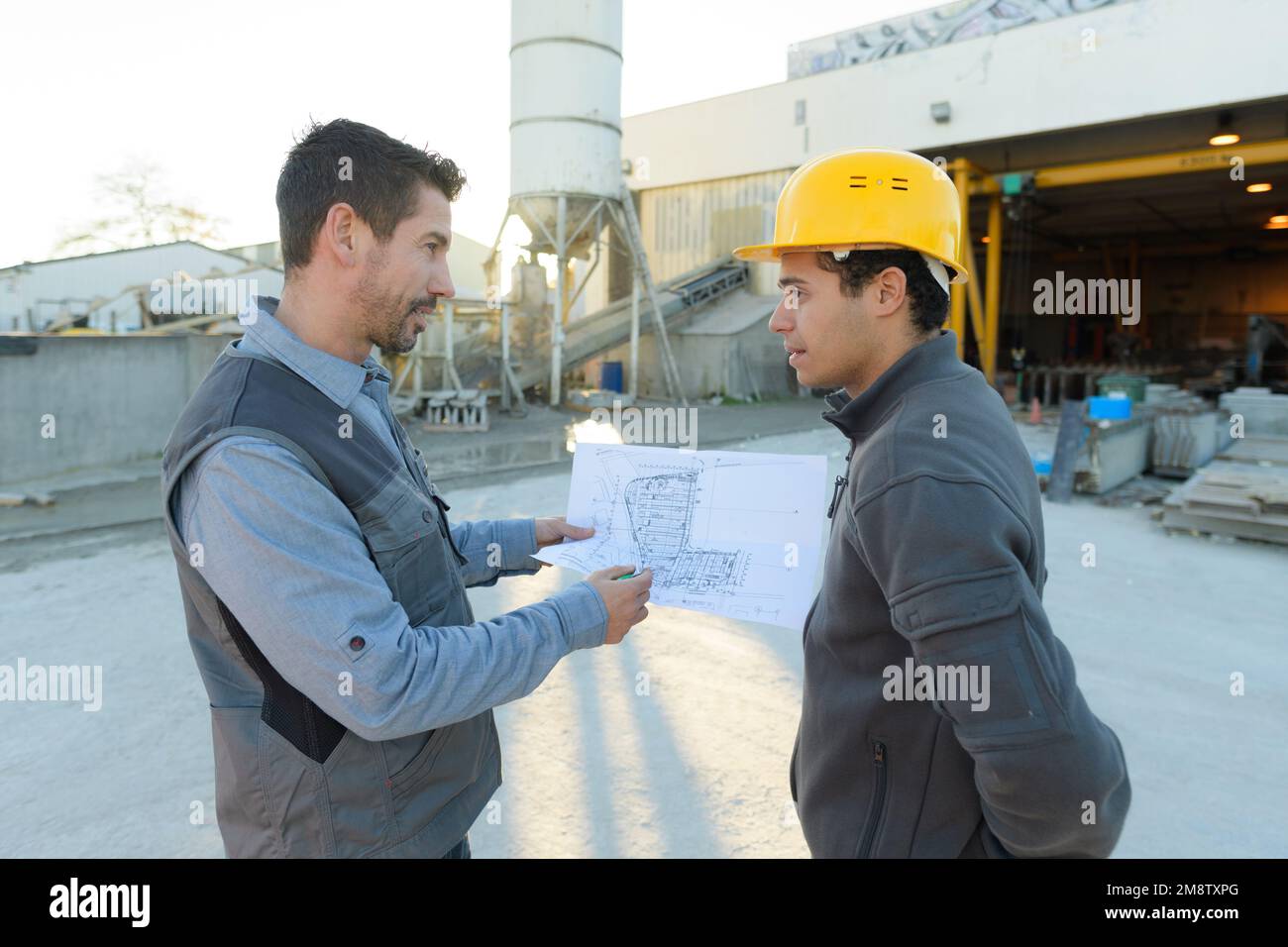 workers in factory outdoors Stock Photo - Alamy