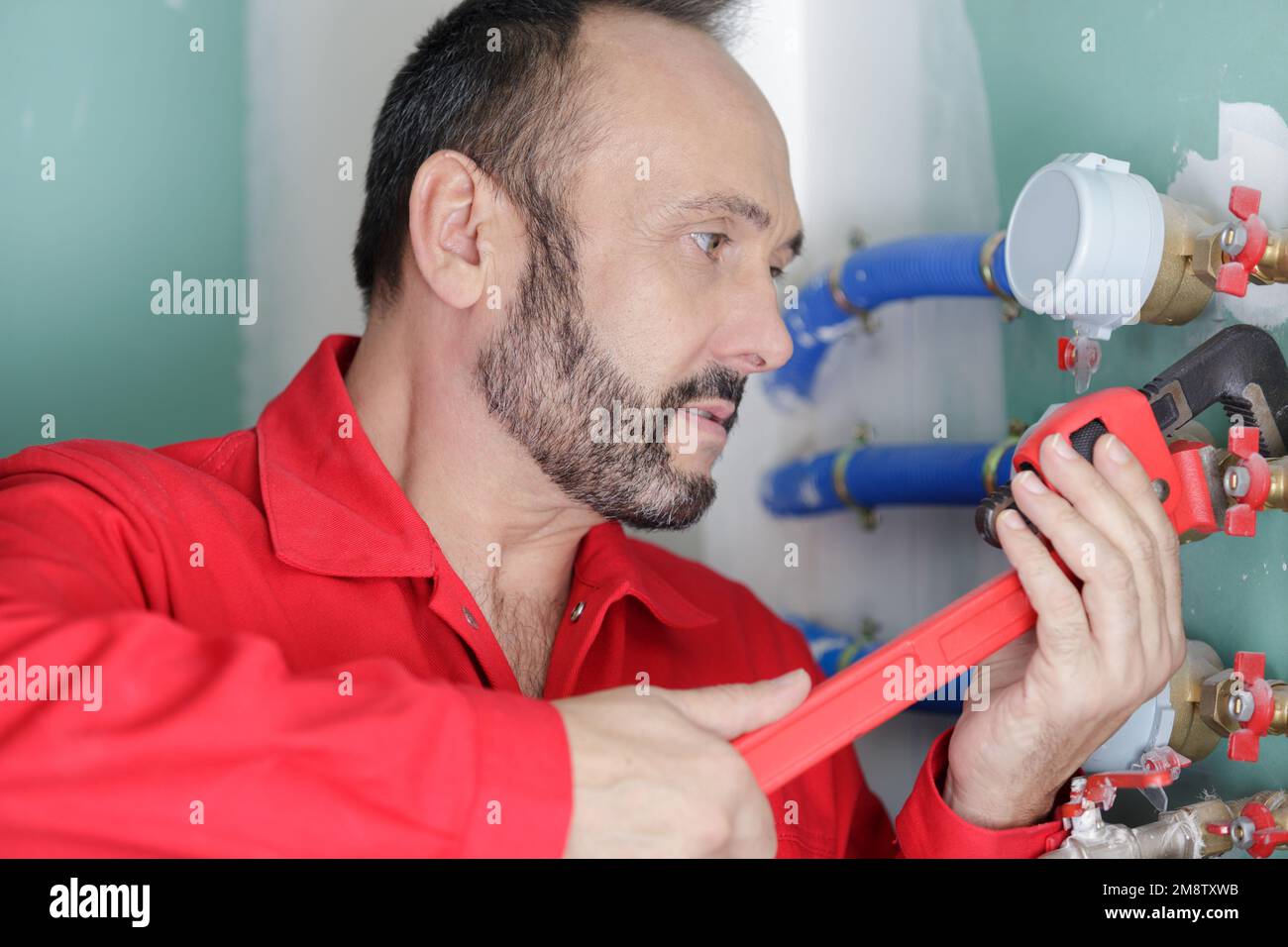 a male worker is checking water meter Stock Photo - Alamy