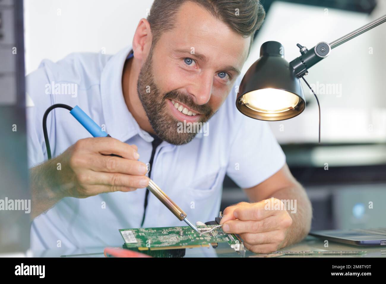 Electrical engineer looking at circuit board hi-res stock photography ...