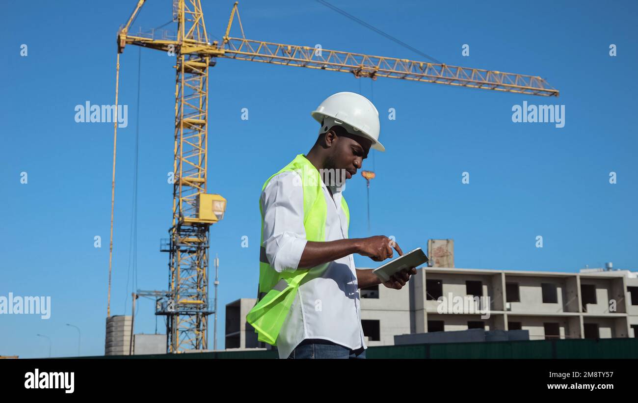 African american constructor monitors process hi-res stock photography ...