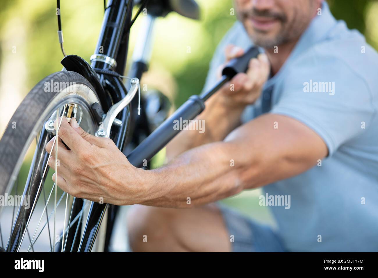 Man using air pump hi-res stock photography and images - Alamy