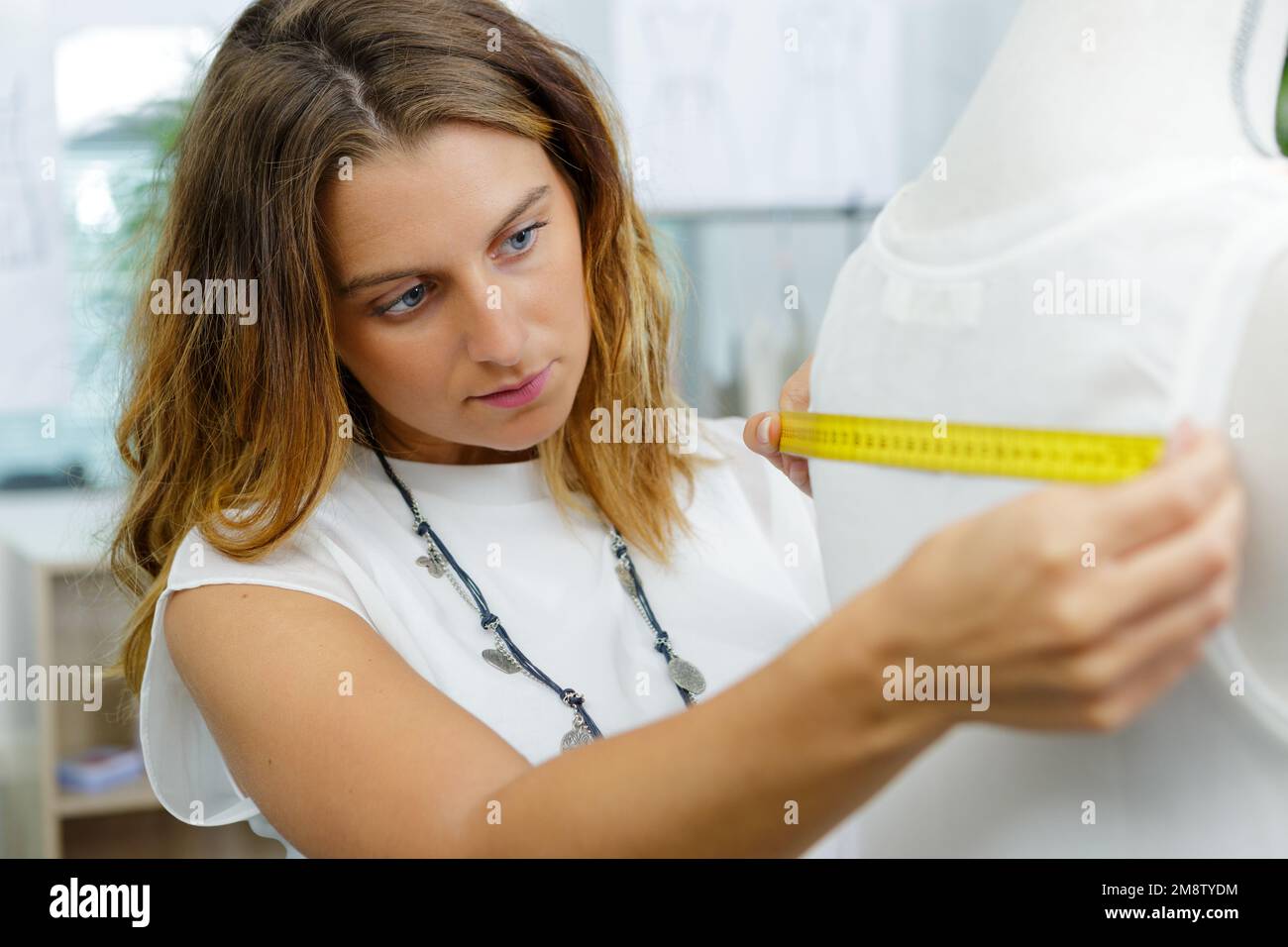 portrait of a young female tailor Stock Photo - Alamy