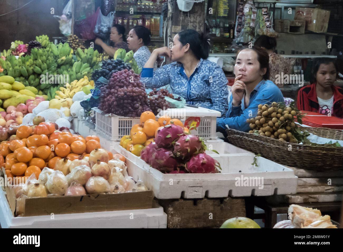 Bored stallholders on a fruit and vegetable stall, Phsar Chas (Old ...