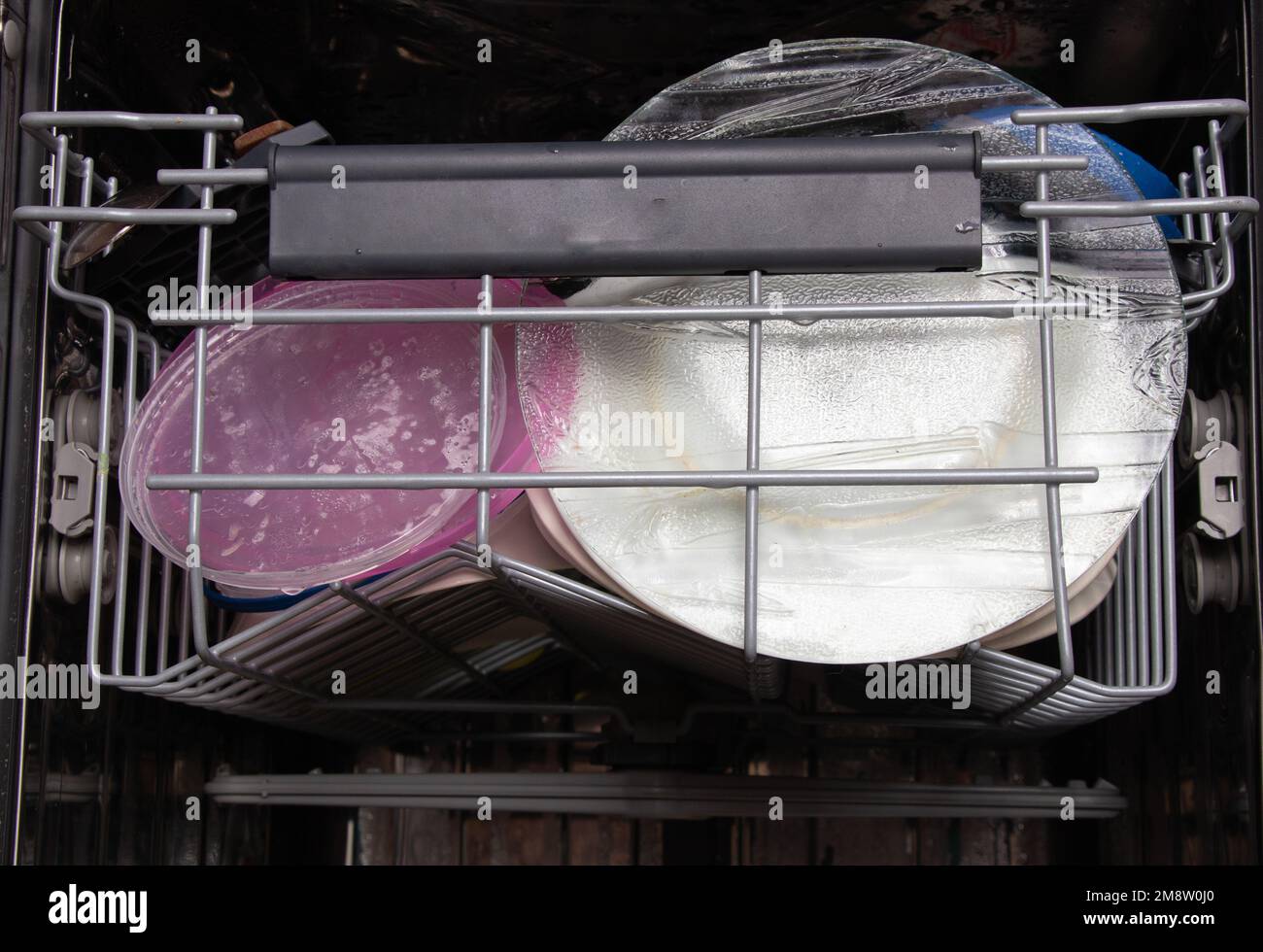 dishwasher with clean plates in the kitchen Stock Photo - Alamy