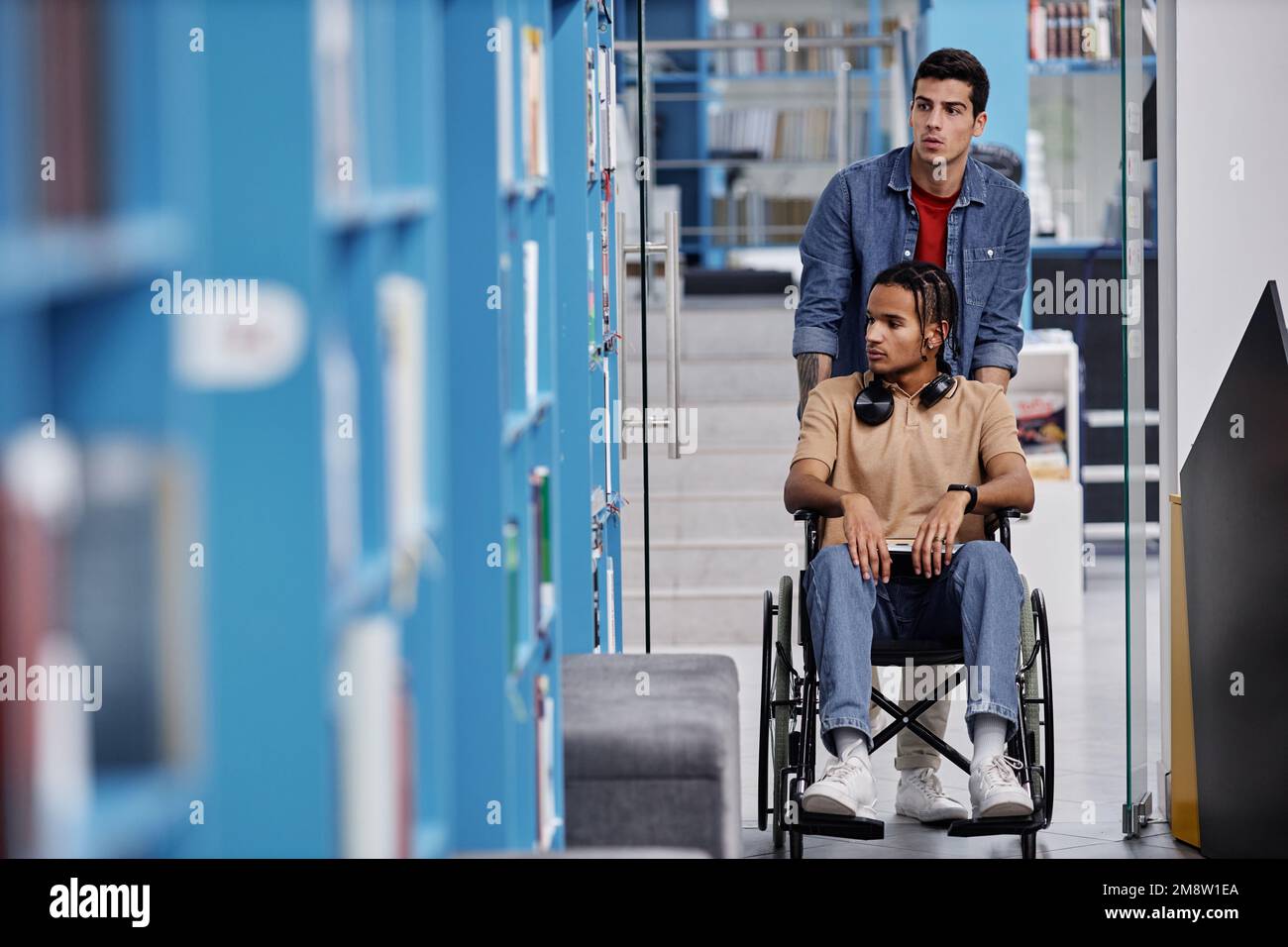 Graphic full length portrait of male student with disability using ...