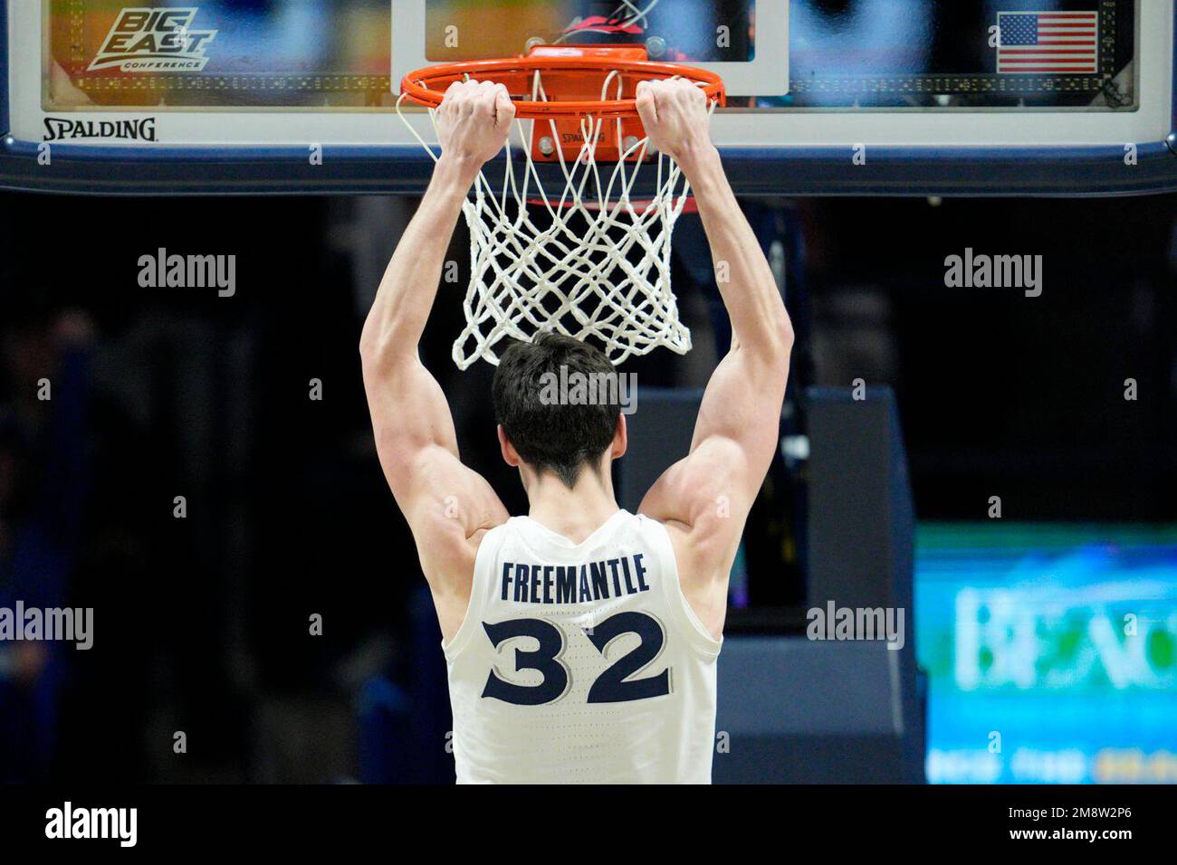 Xavier forward Zach Freemantle (32) hangs on the rim after dunking ...