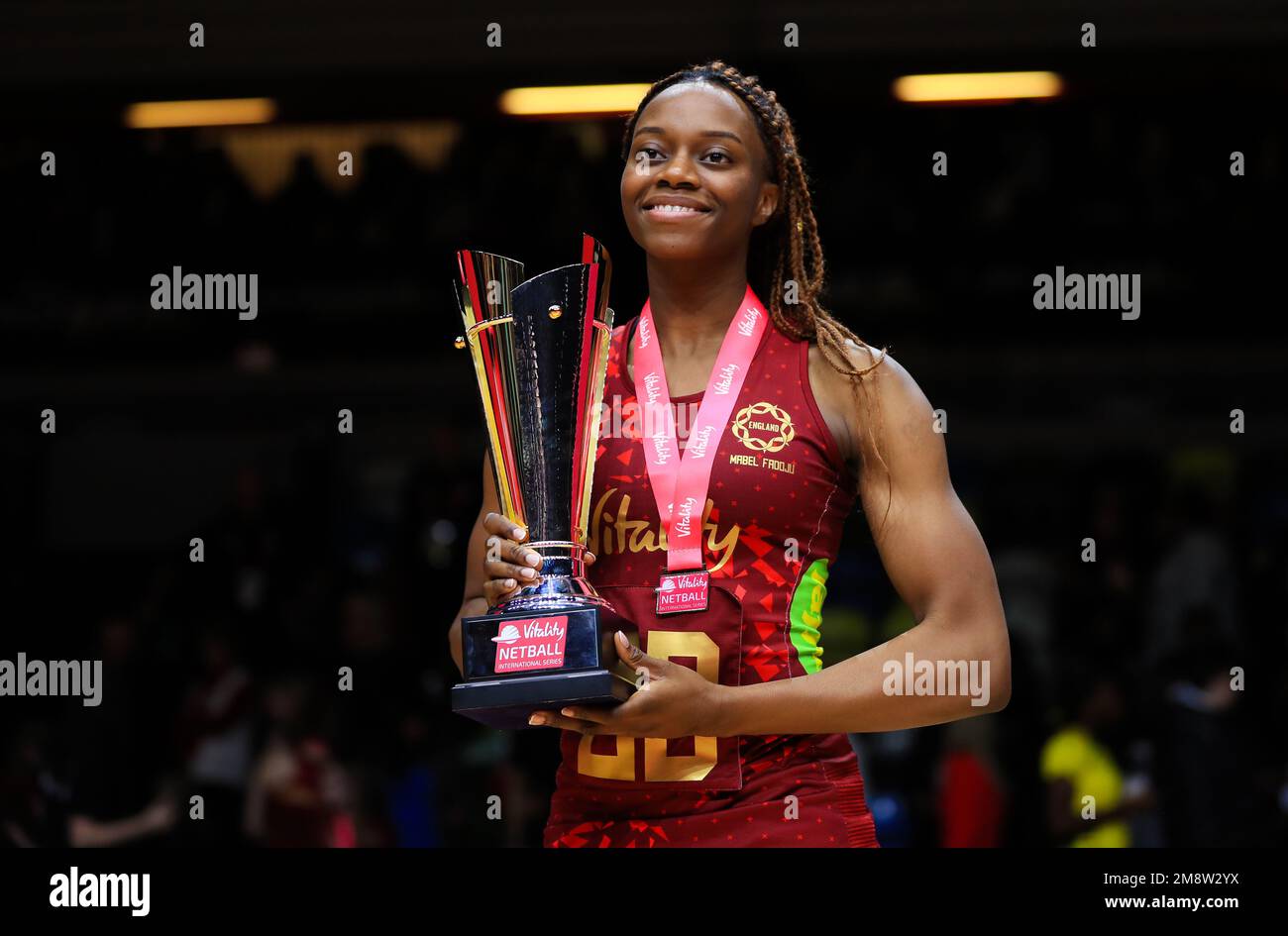 England’s Funmi Fadoju poses with their trophy after winning the ...