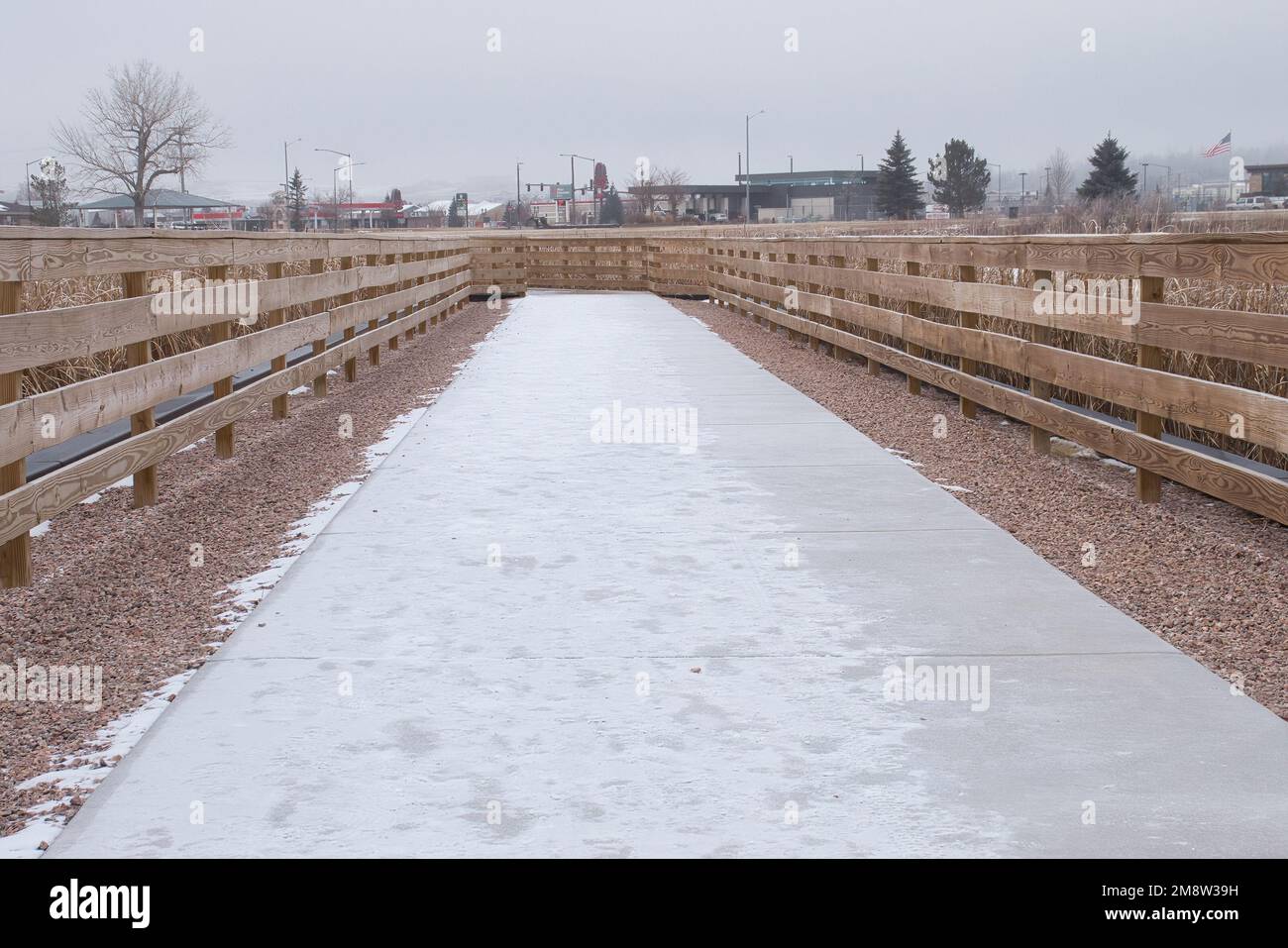 Gillette, Wyoming - January 25, 2021: Light snow covering walking path ...