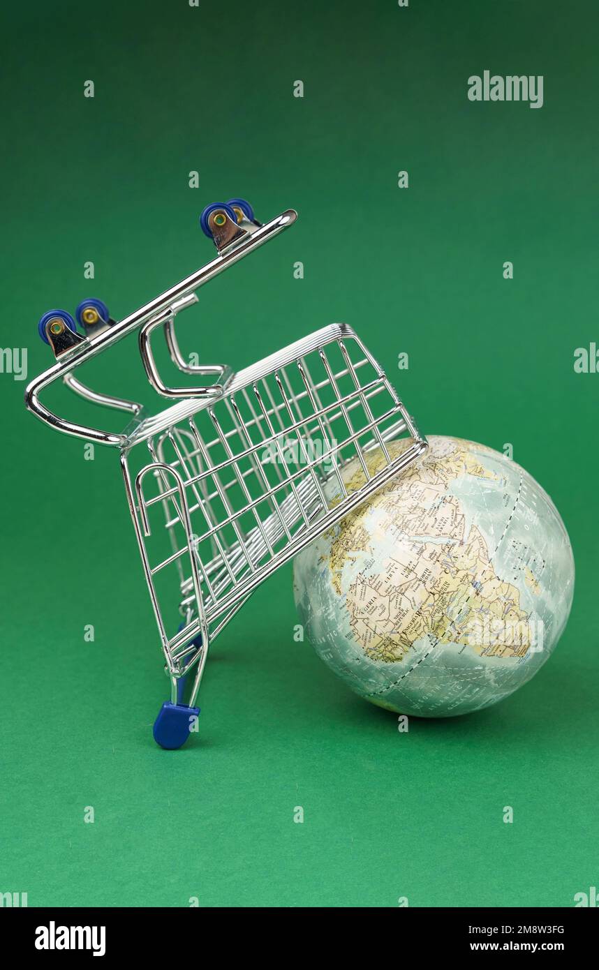 The globe is enclosed in an inverted basket on a green background ...