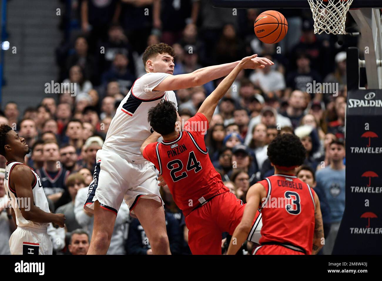 UConn's Donovan Clingan, left, fouls St. John's Rafael Pinzon in the ...