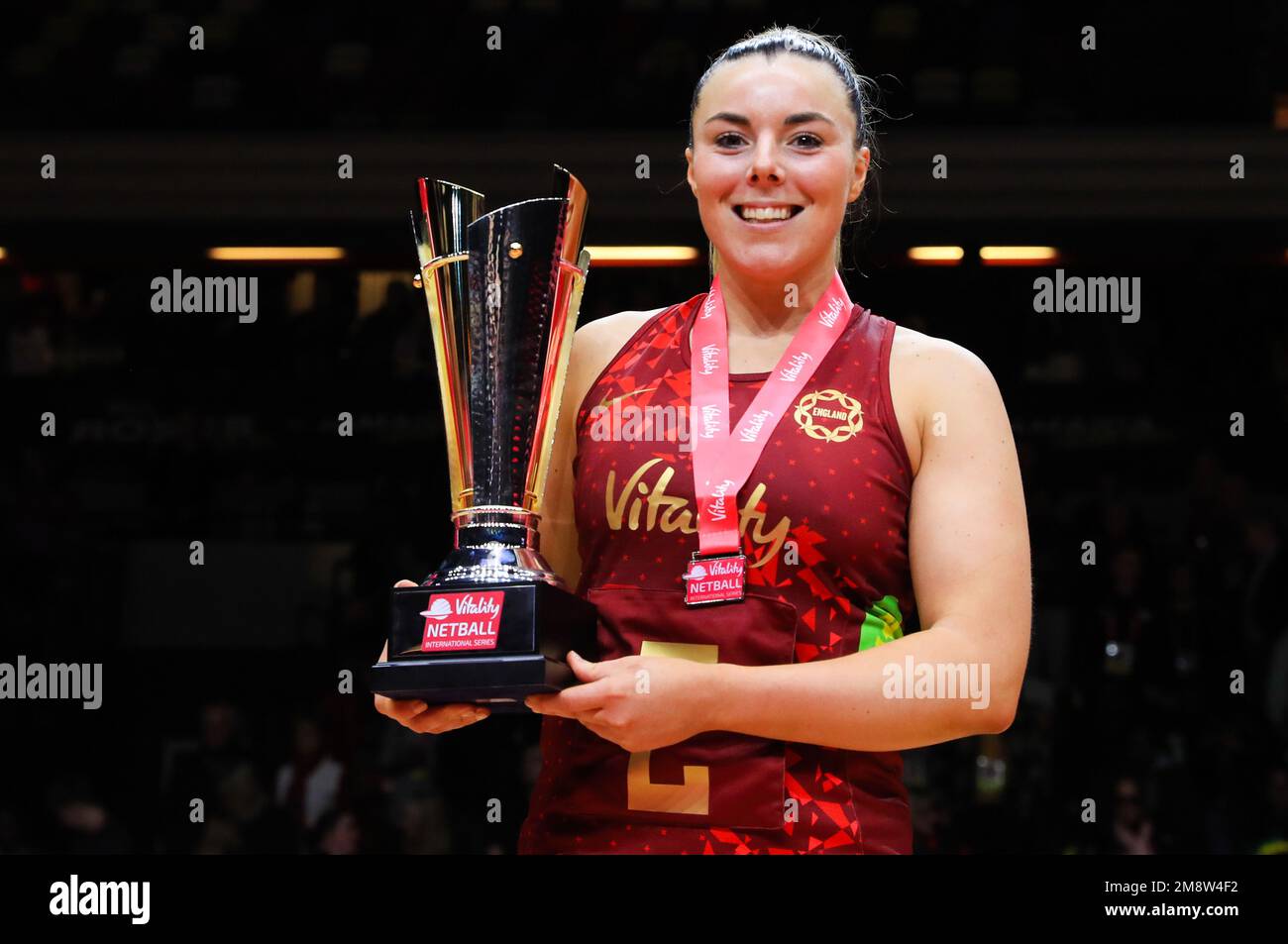 England’s Elle McDonald poses with their trophy after winning the ...