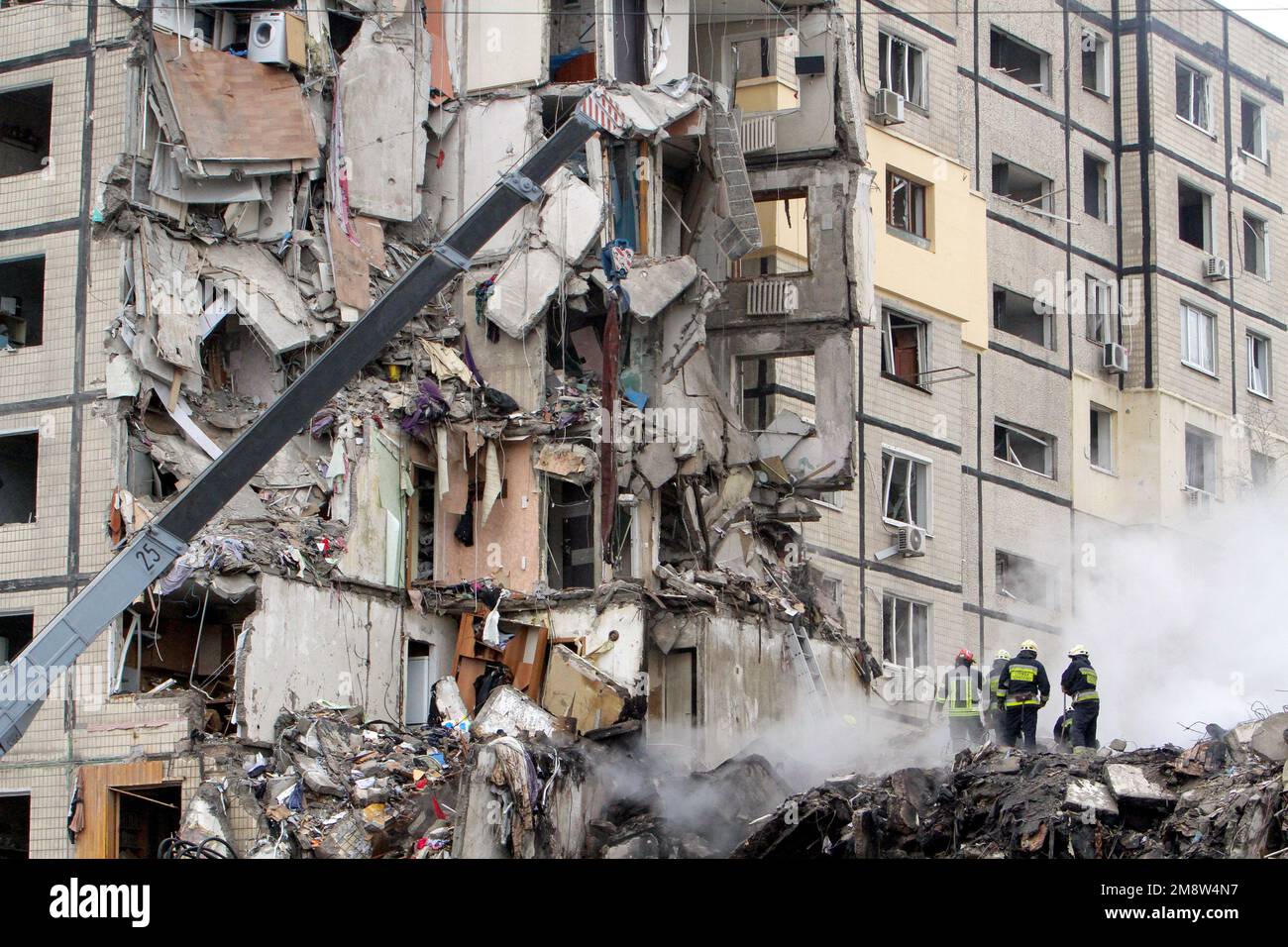 DNIPRO, UKRAINE - JANUARY 15, 2023 - Rescuers remove the rubble and search for people at an ...