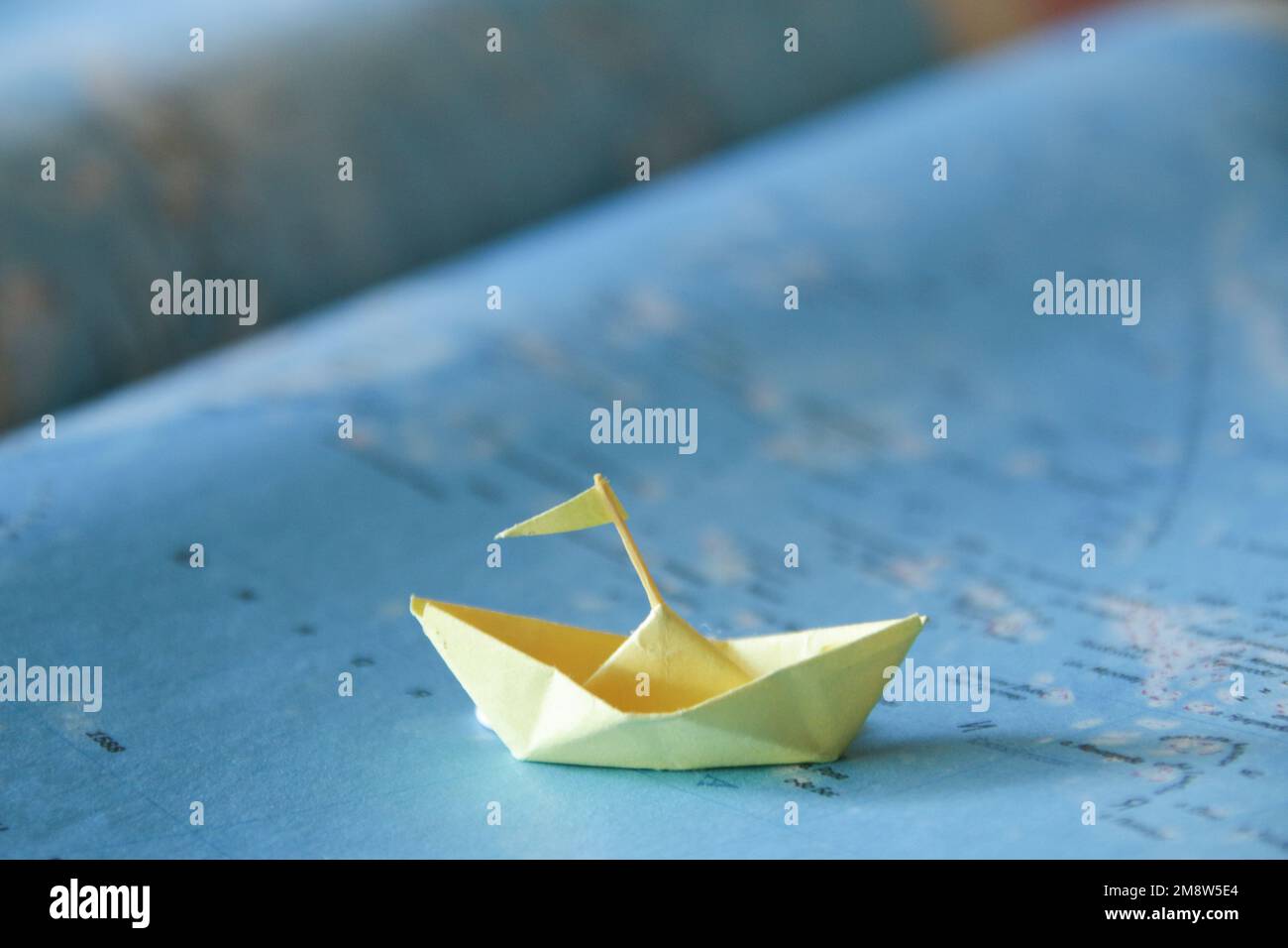 Paper boat on the map. Delivery or summer travel idea Stock Photo - Alamy