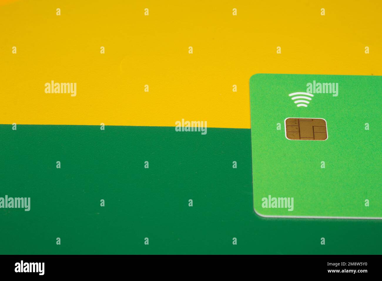 A blank card with a brown square chip symbol and a WiFi symbol. Concept ...