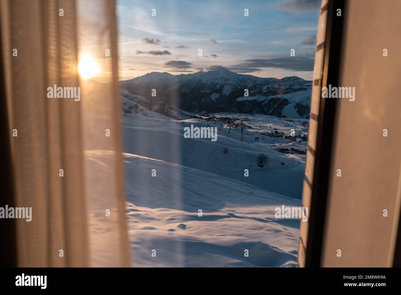 beautiful view from hotel room window at winter mountain at ski resort ...