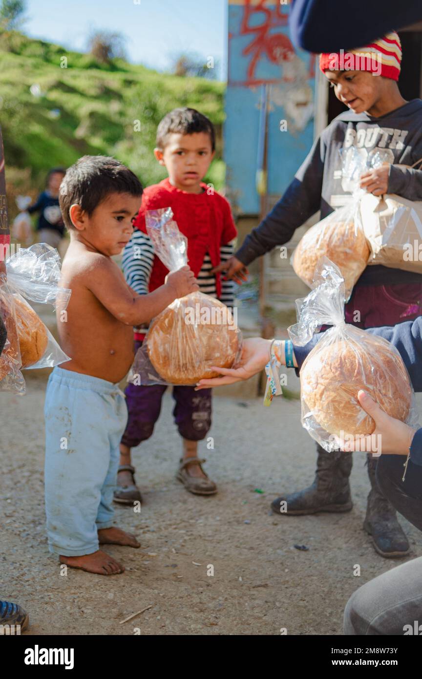 The poor little children in a Romanian hellhole holding breads in ...