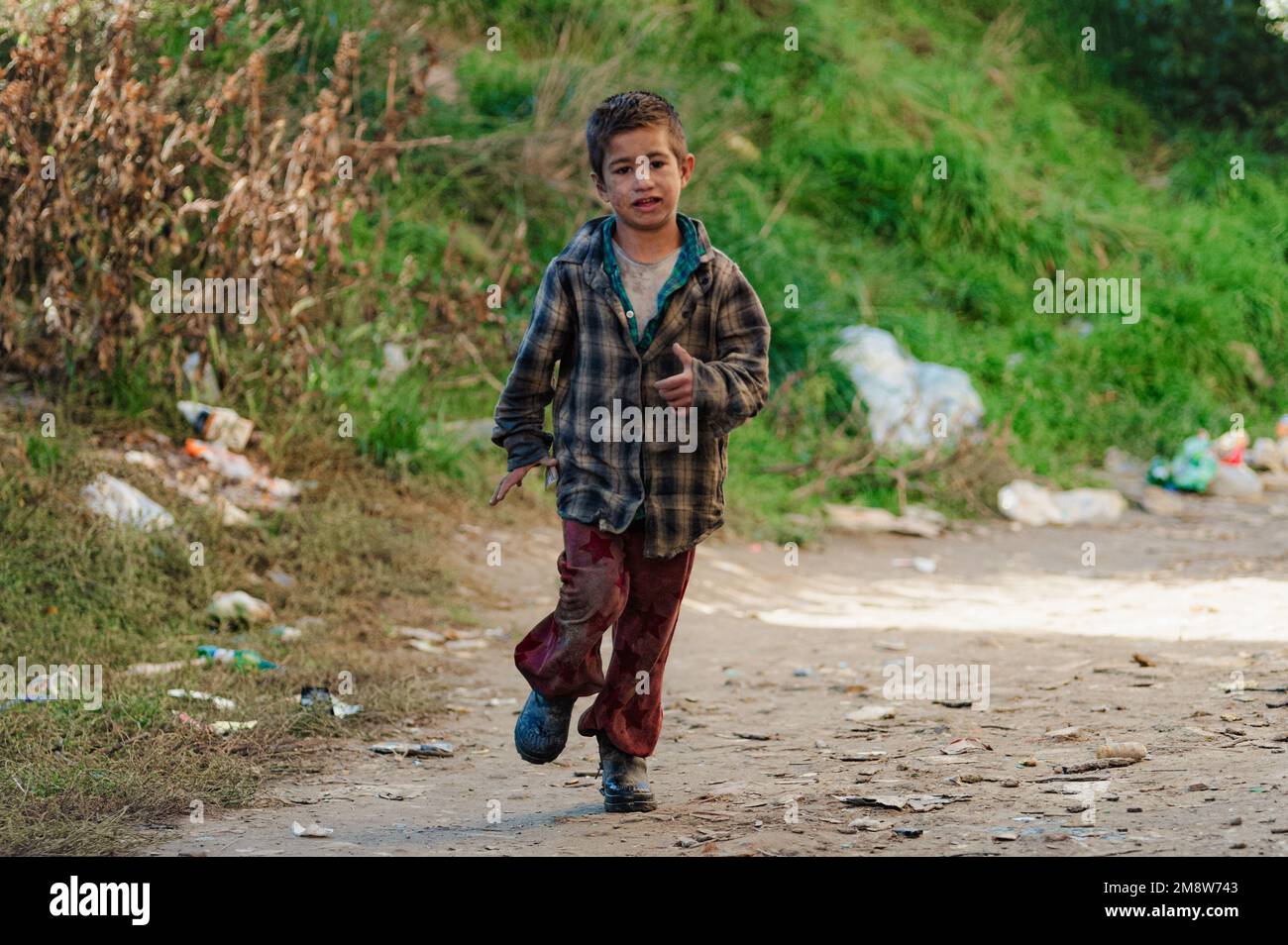 Poor hungry kid hi-res stock photography and images - Alamy