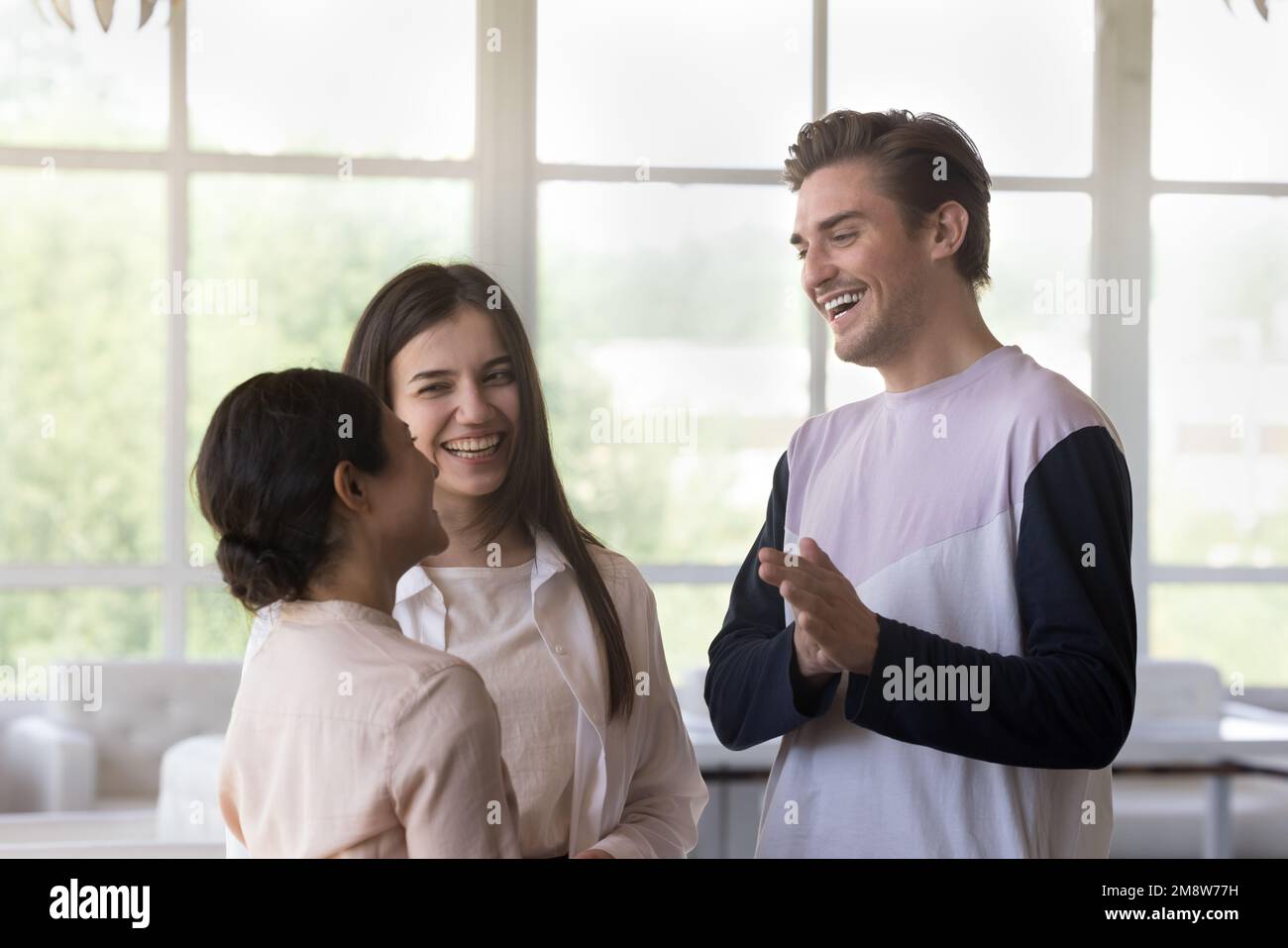 Multiethnic happy friends chatting and laughing, meeting in cafe Stock ...