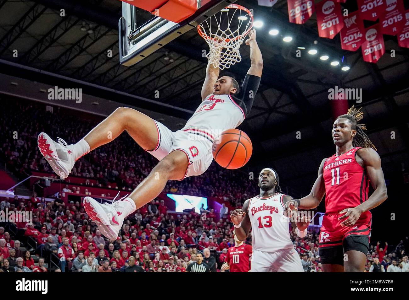 Ohio State's Zed Key (23) dunks as Rutgers' Clifford Omoruyi (11) looks ...